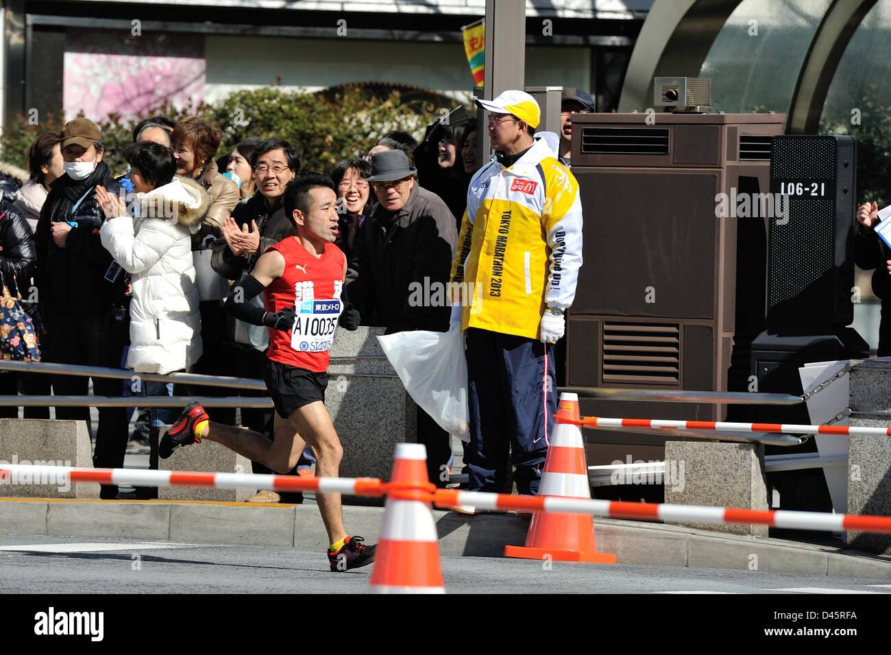 February 24, 2013, Tokyo, Japan - Runners make their way past Ginza ...