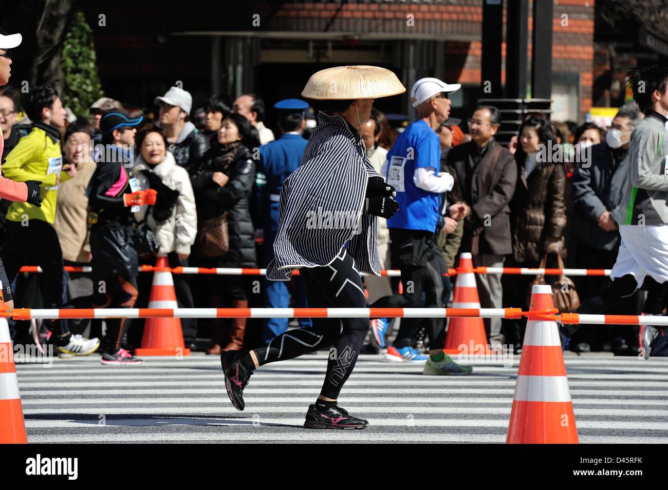 February 24, 2013, Tokyo, Japan - A participant dressed in costume runs ...