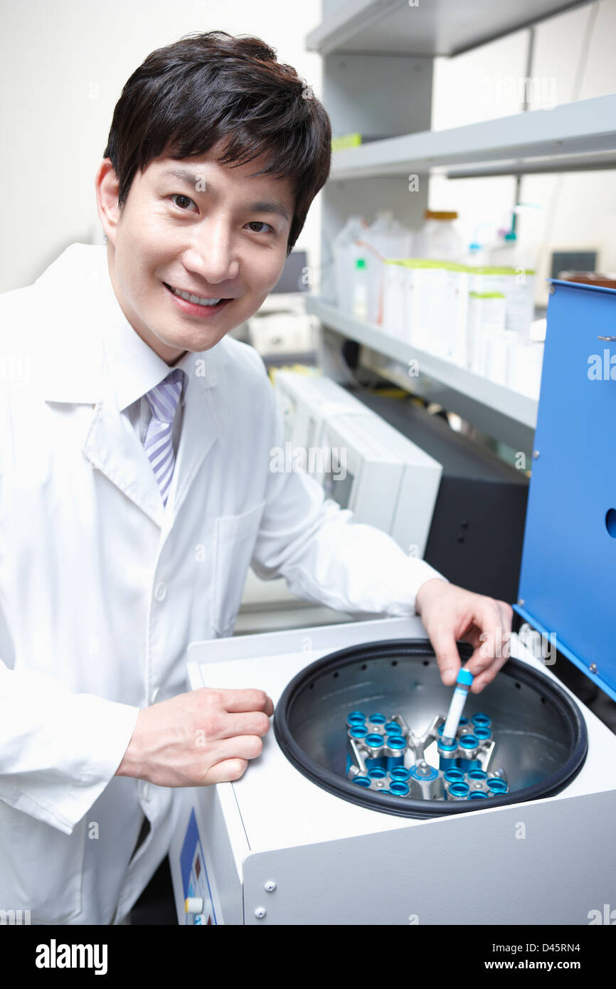 a doctor putting sample case into a box Stock Photo - Alamy