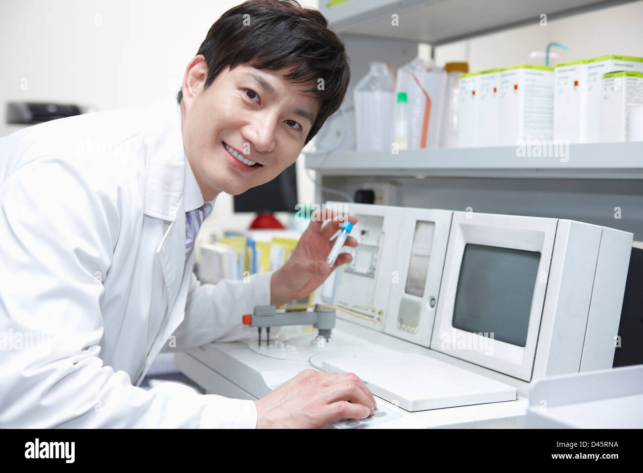 a doctor checking on a medical computer Stock Photo - Alamy