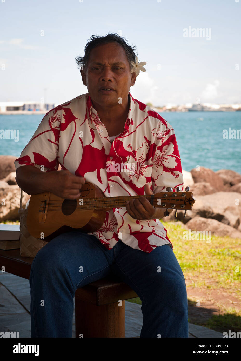 Polynesian man playing ukulele and singing, Papeete Stock Photo - Alamy