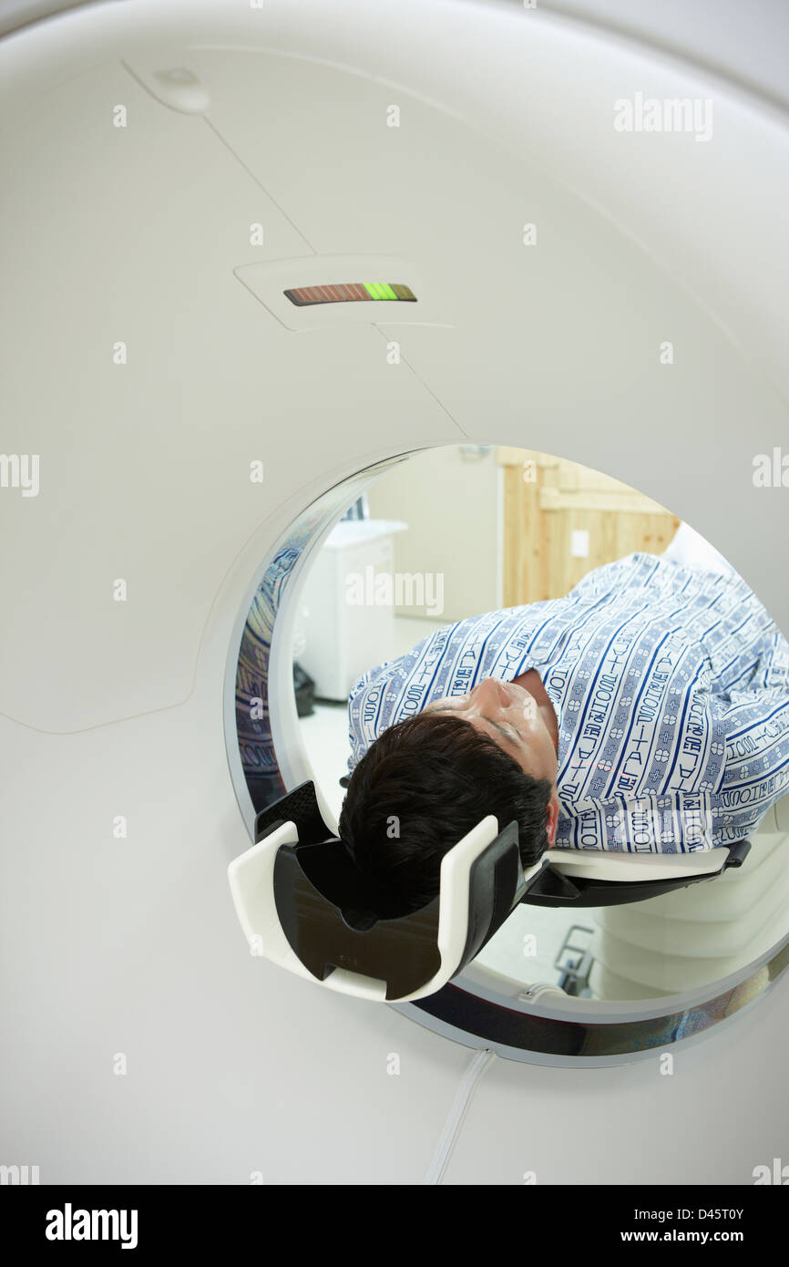 a patient going through a CT scanner Stock Photo - Alamy