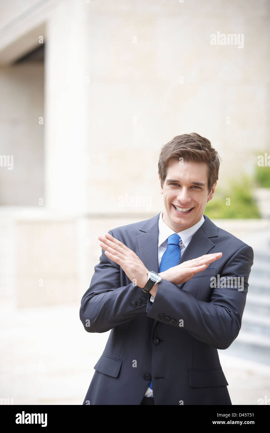 a western businessman with arms saying no Stock Photo - Alamy