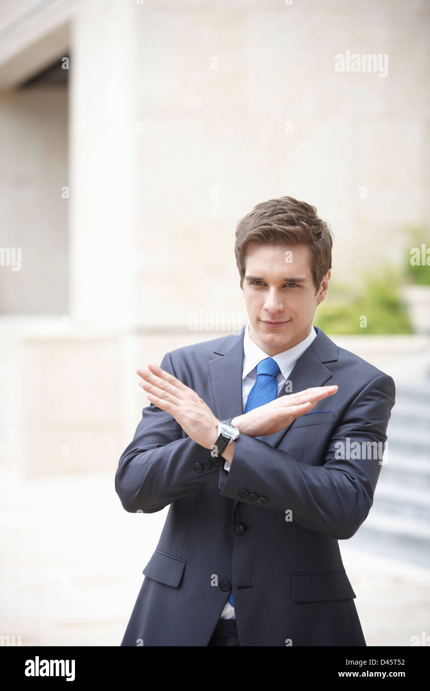 a western businessman with arms saying no Stock Photo - Alamy