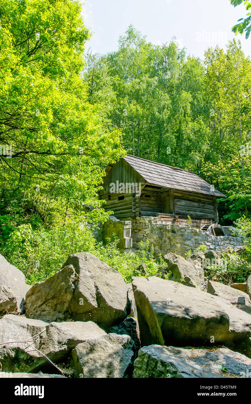 A typical ukrainian antique stone house in the forest, in Pirogovo near ...