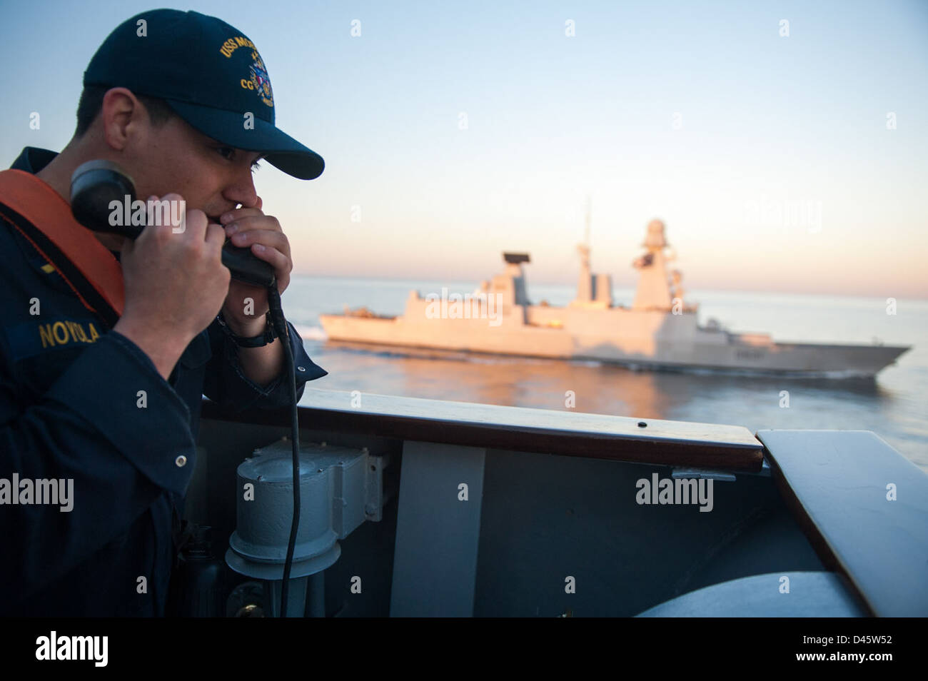 A Sailor aboard USS Mobile Bay alongside Chevalier Paul Stock Photo - Alamy
