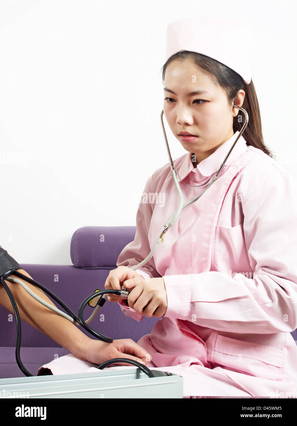 The nurses are measuring blood pressure Stock Photo - Alamy