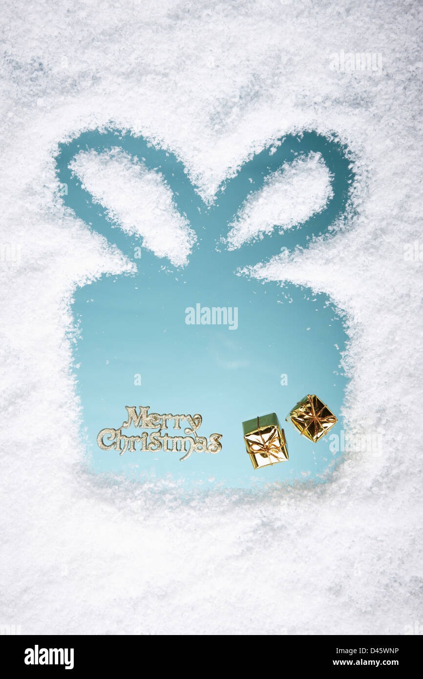 shape of a present in snow Stock Photo - Alamy