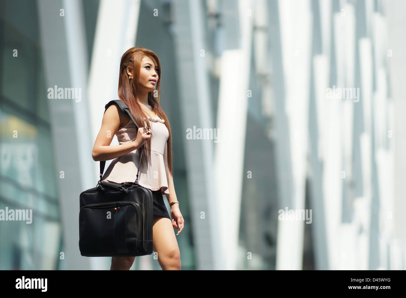 Office girl walking outside hi-res stock photography and images - Alamy