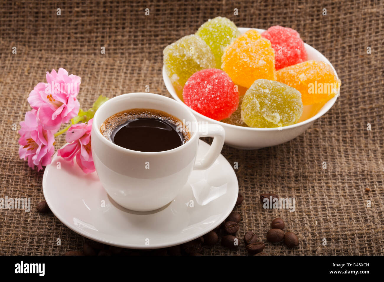 Flowers, coffee and sweets. Closeup Stock Photo - Alamy