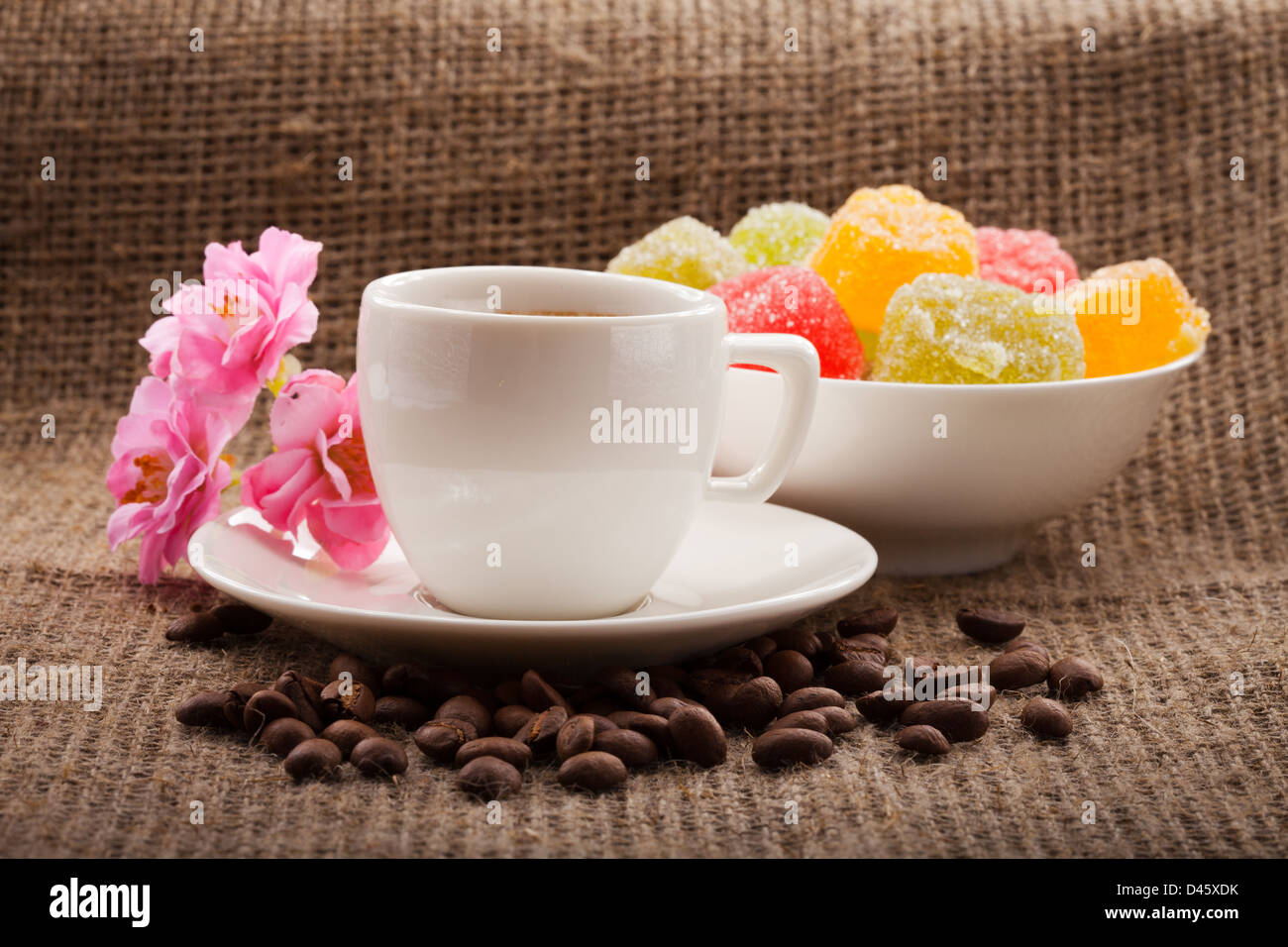 Flowers, coffee and sweets. Closeup Stock Photo - Alamy