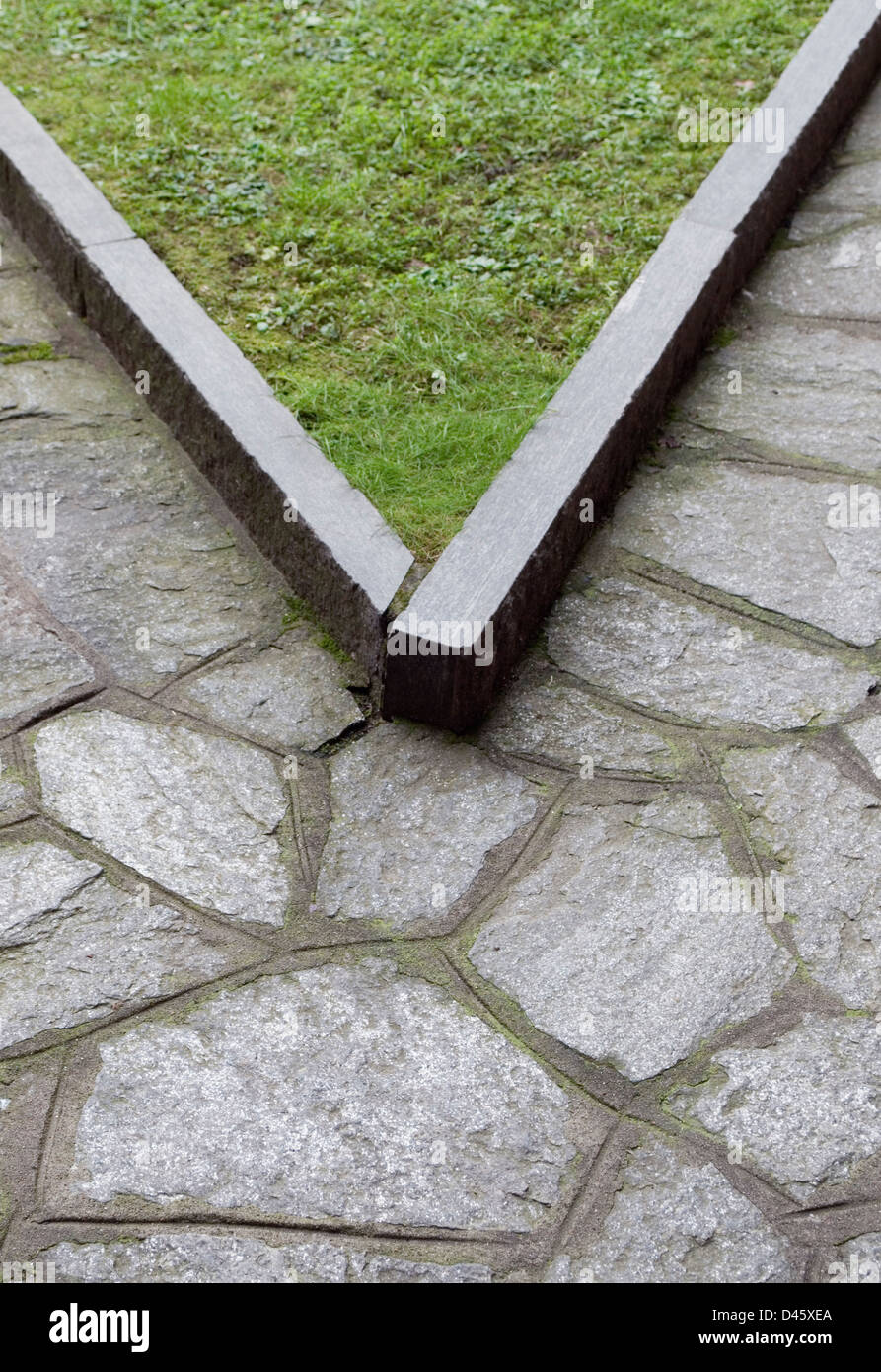 green corner and stone pavement Stock Photo - Alamy