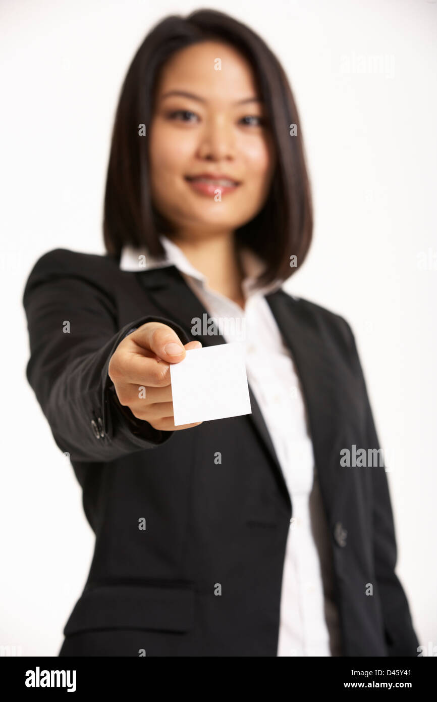 Studio Portrait Of Chinese Businesswoman Offering Business Card Stock ...