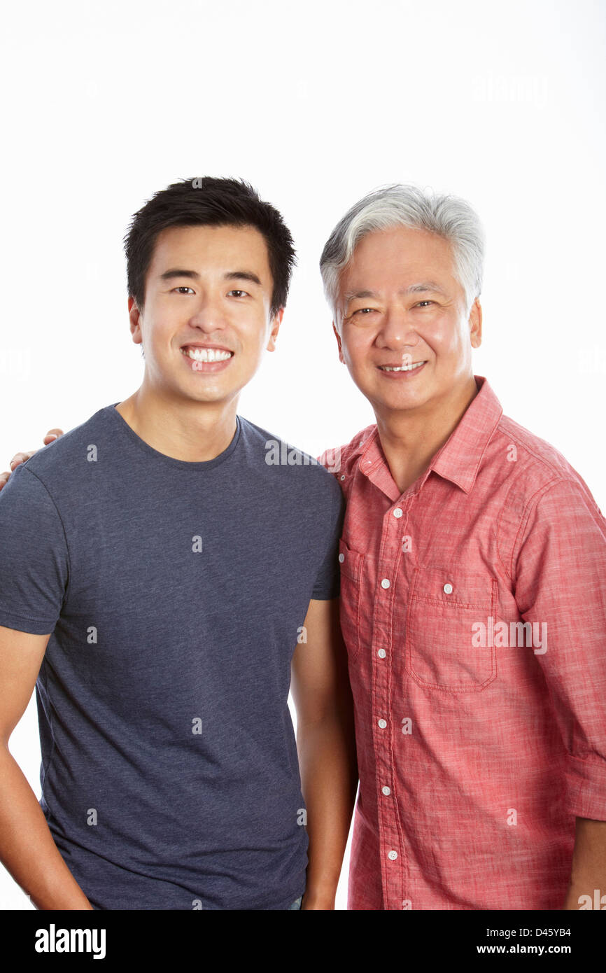 Studio Portrait Of Chinese Father With Adult Son Stock Photo - Alamy
