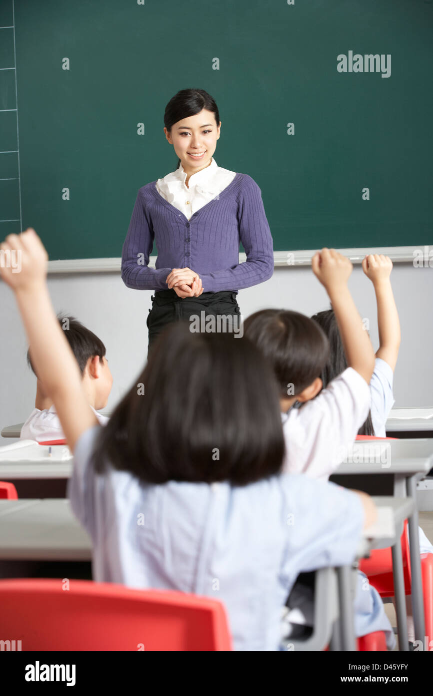 Teacher With Students In Chinese School Classroom Stock Photo - Alamy