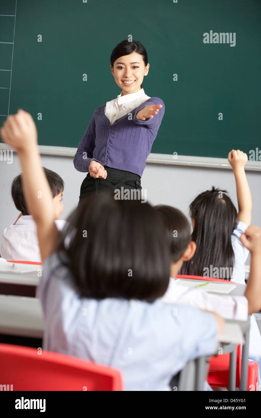 Teacher With Students In Chinese School Classroom Stock Photo - Alamy
