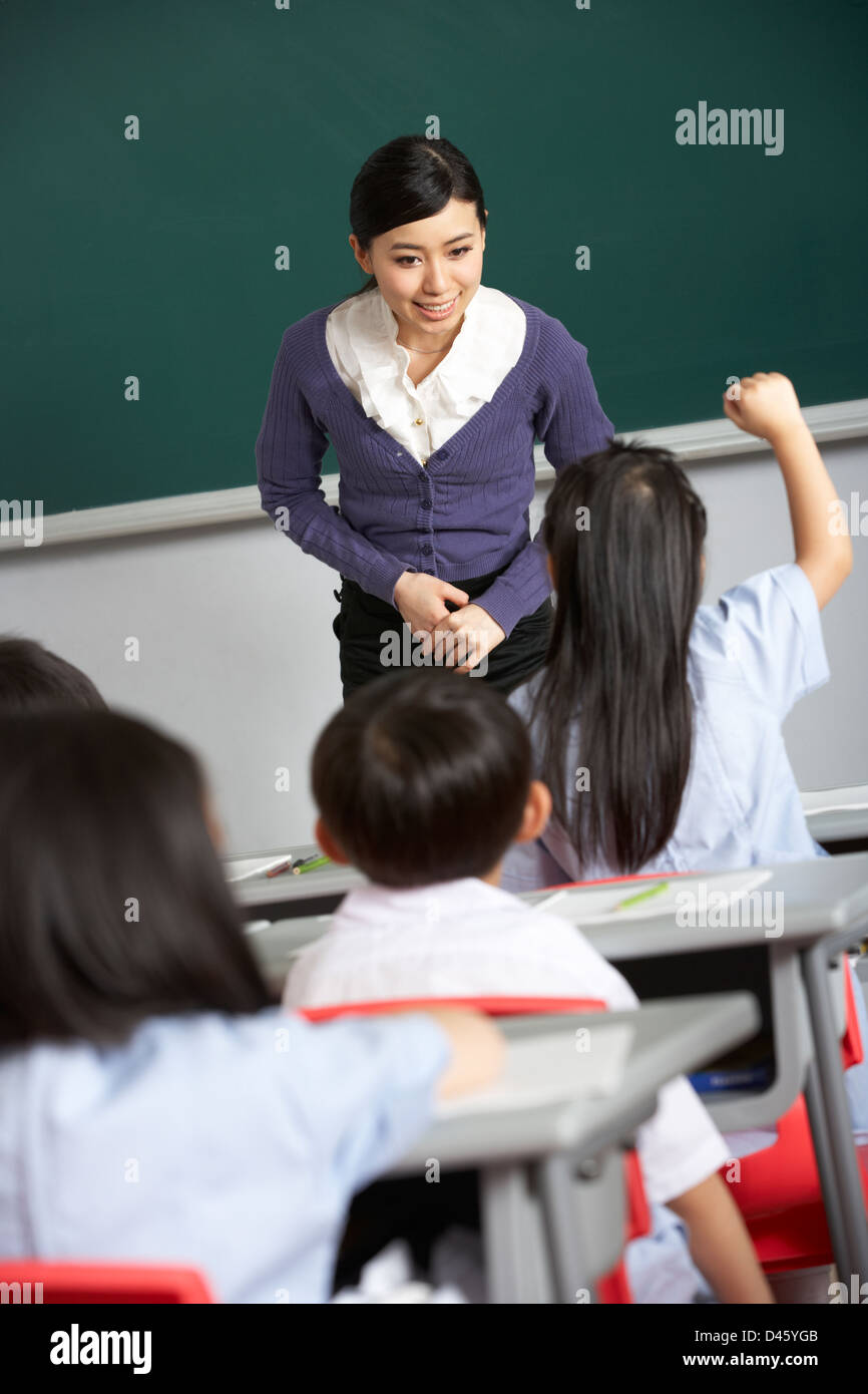 Teacher With Students In Chinese School Classroom Stock Photo - Alamy