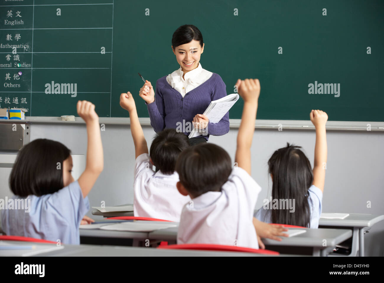 Teacher With Students In Chinese School Classroom Stock Photo - Alamy