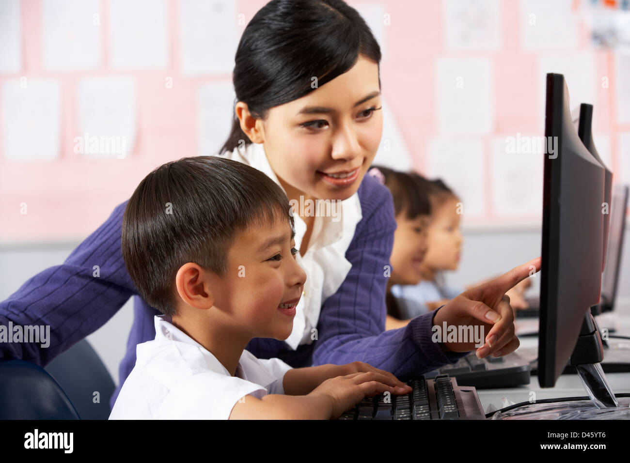 School children teacher computer hi-res stock photography and images ...