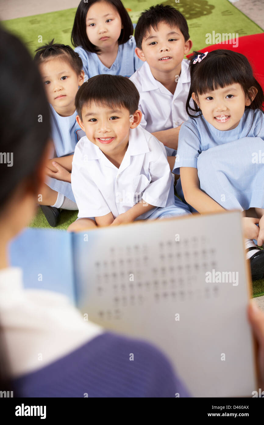 Female Elementary Pupil Reading In Stock Photos & Female Elementary ...