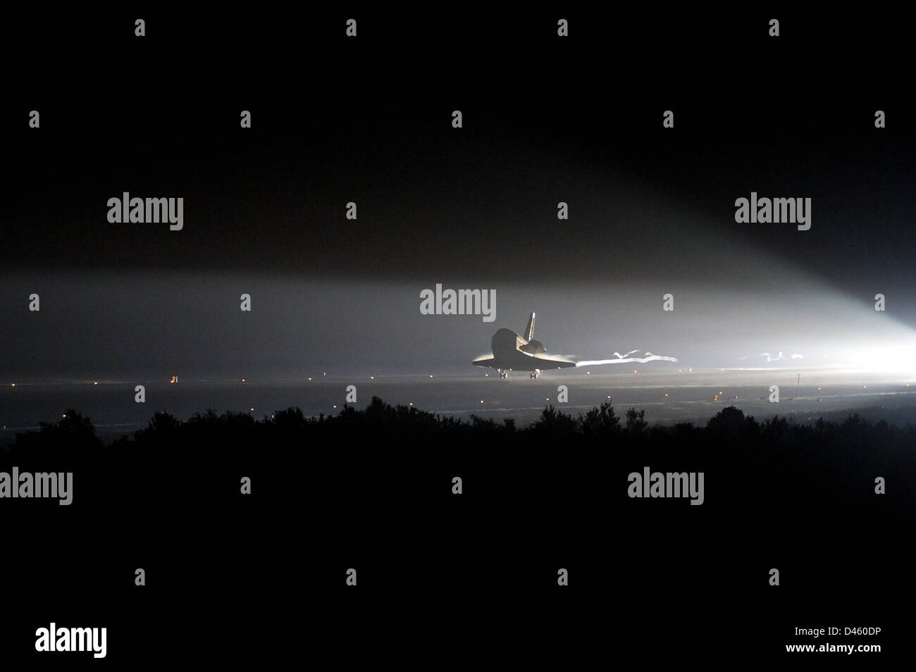 The Space Shuttle Endeavour lands at the Shuttle Landing Facility at ...