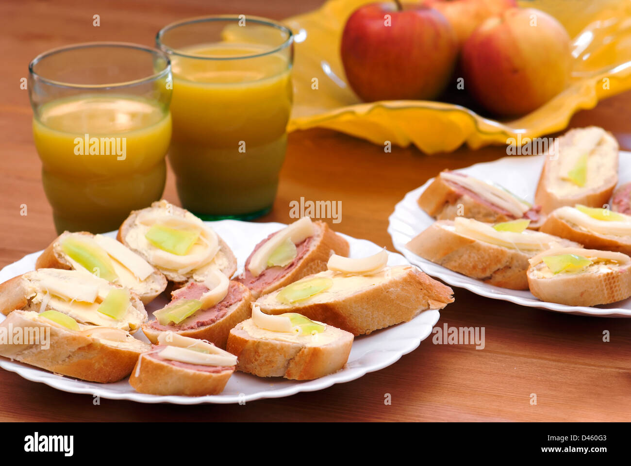 Breakfast. Canapes with juice and apples Stock Photo - Alamy