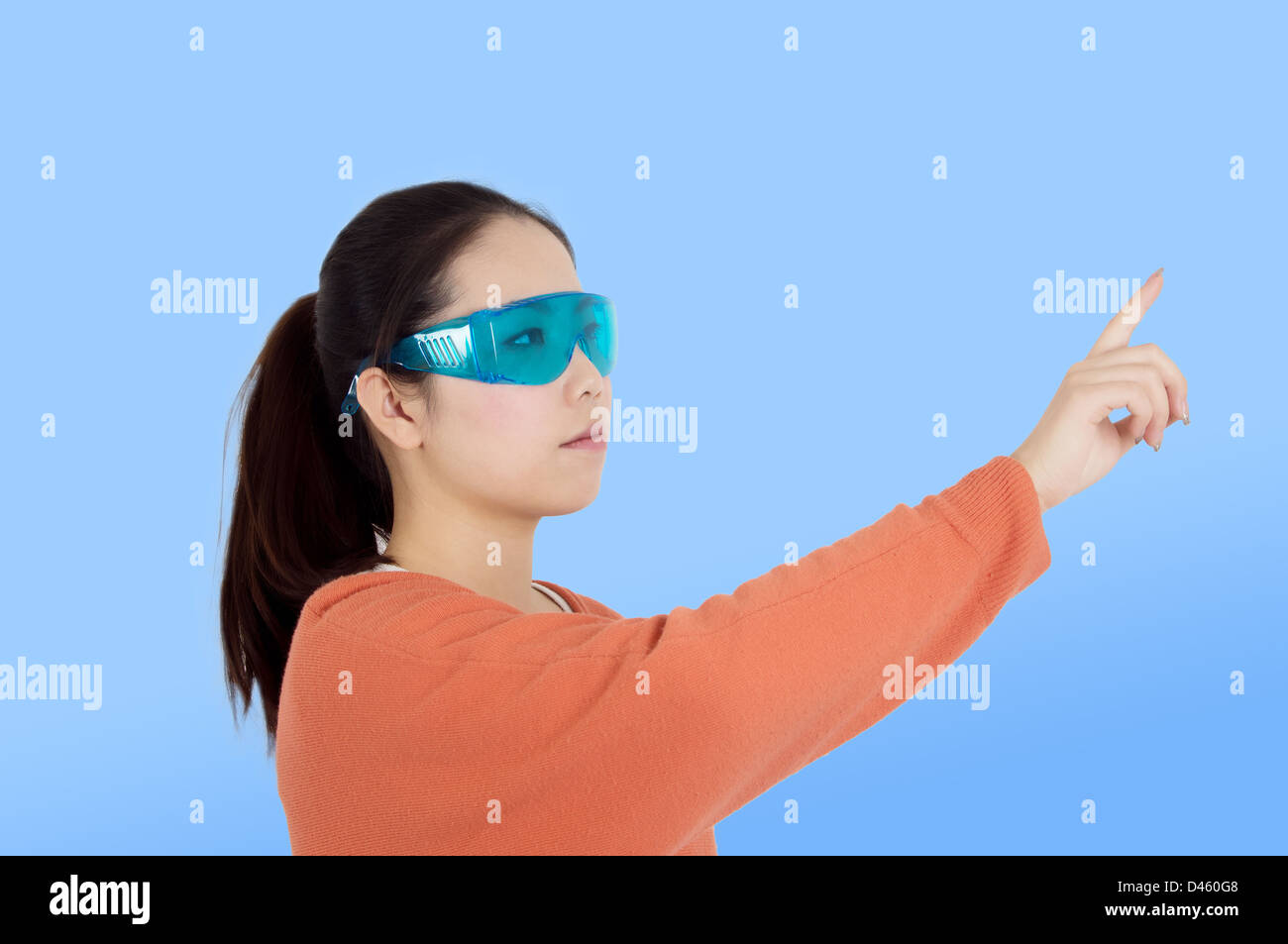 Pretty young lady using hand tap the screen Stock Photo - Alamy