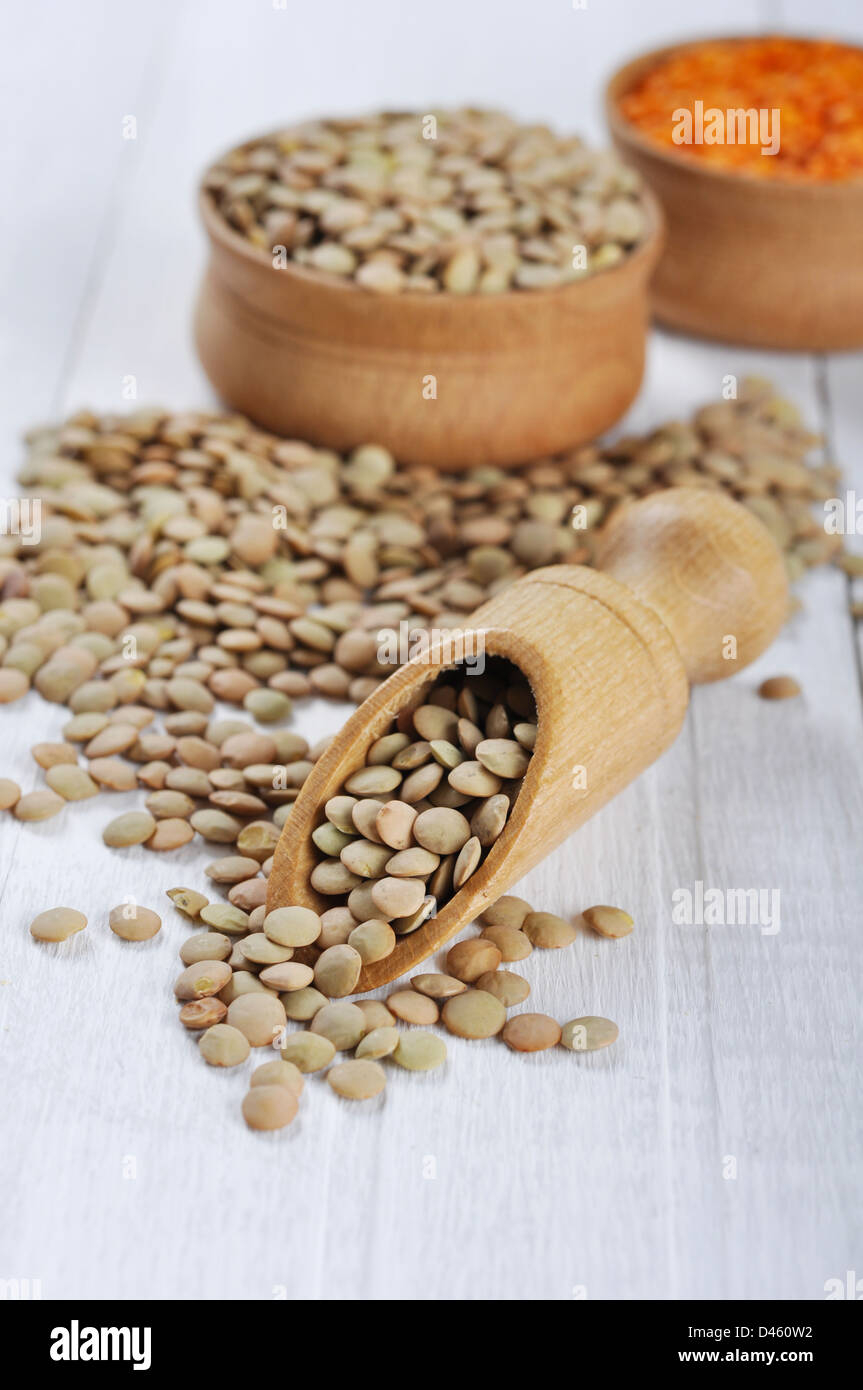 Lentil seeds on a white wooden background Stock Photo - Alamy