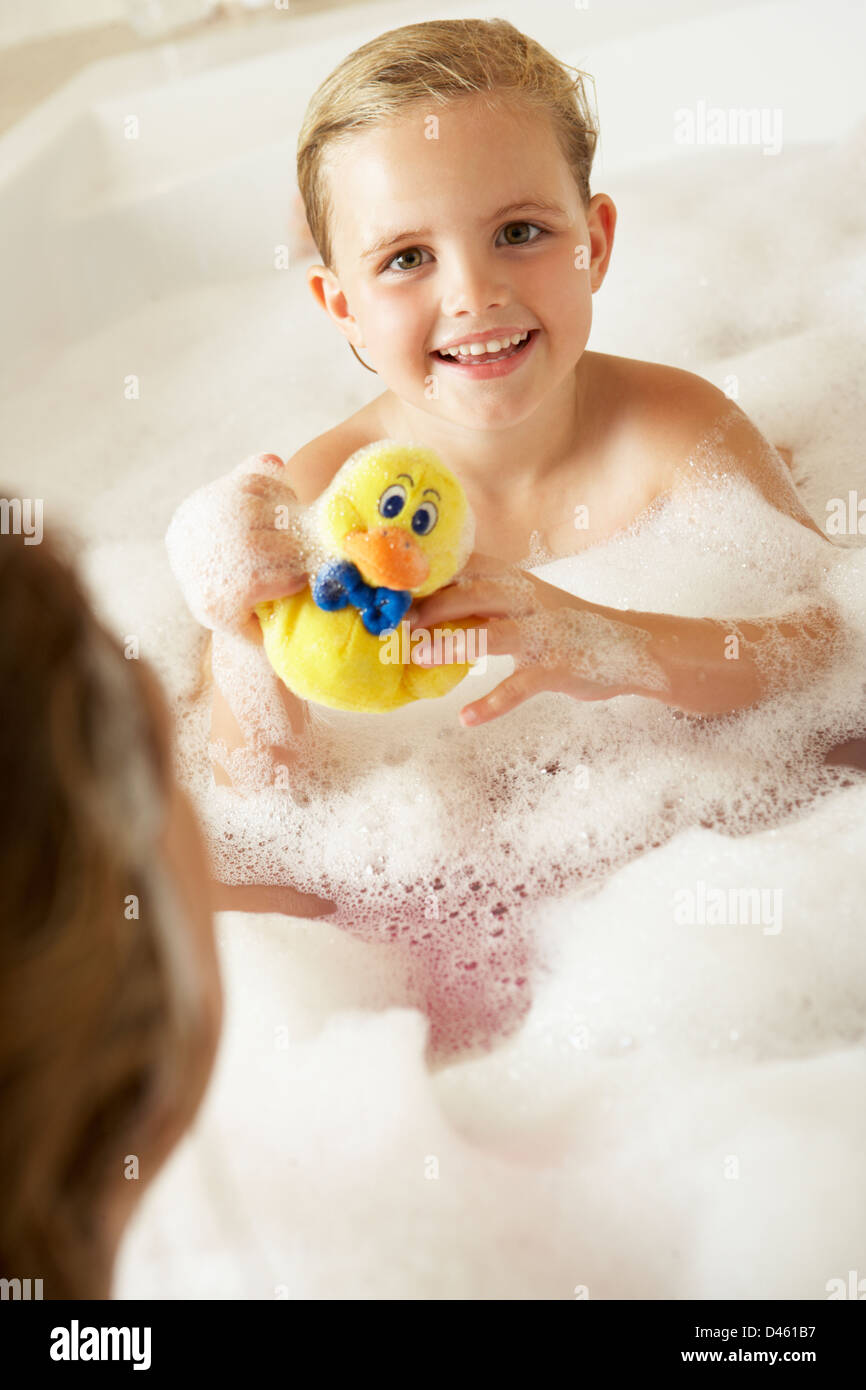 Mother And Daughter Relaxing In Bubble Filled Bath Stock Photo - Alamy