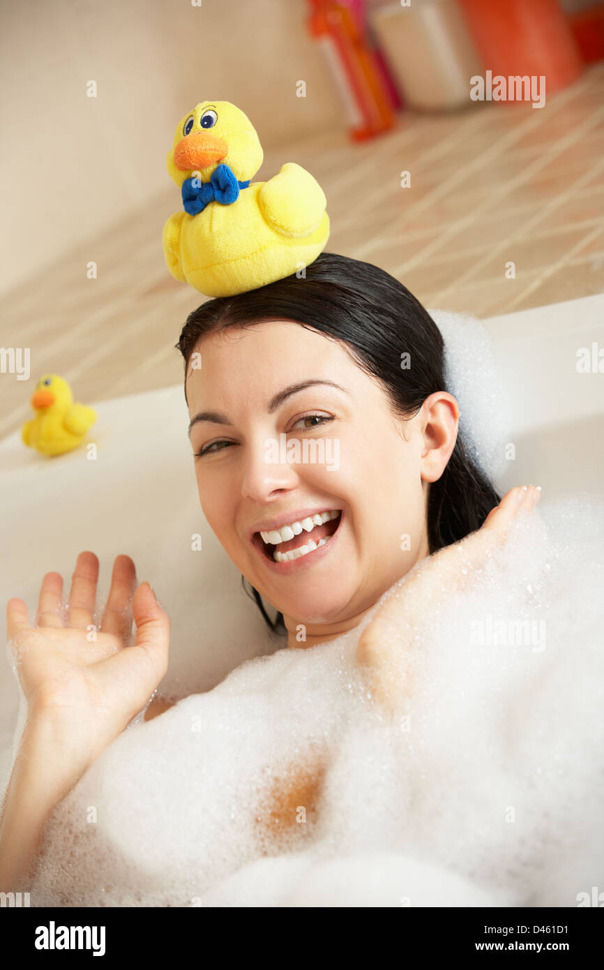 Woman Relaxing In Bubble Filled Bath Stock Photo - Alamy