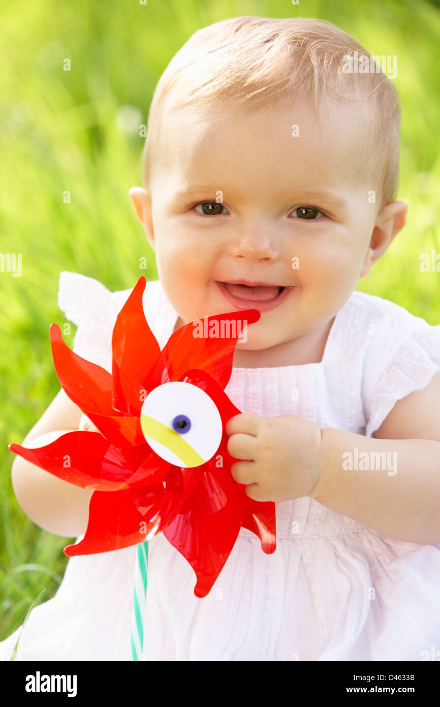 Baby holding windmill hi-res stock photography and images - Alamy