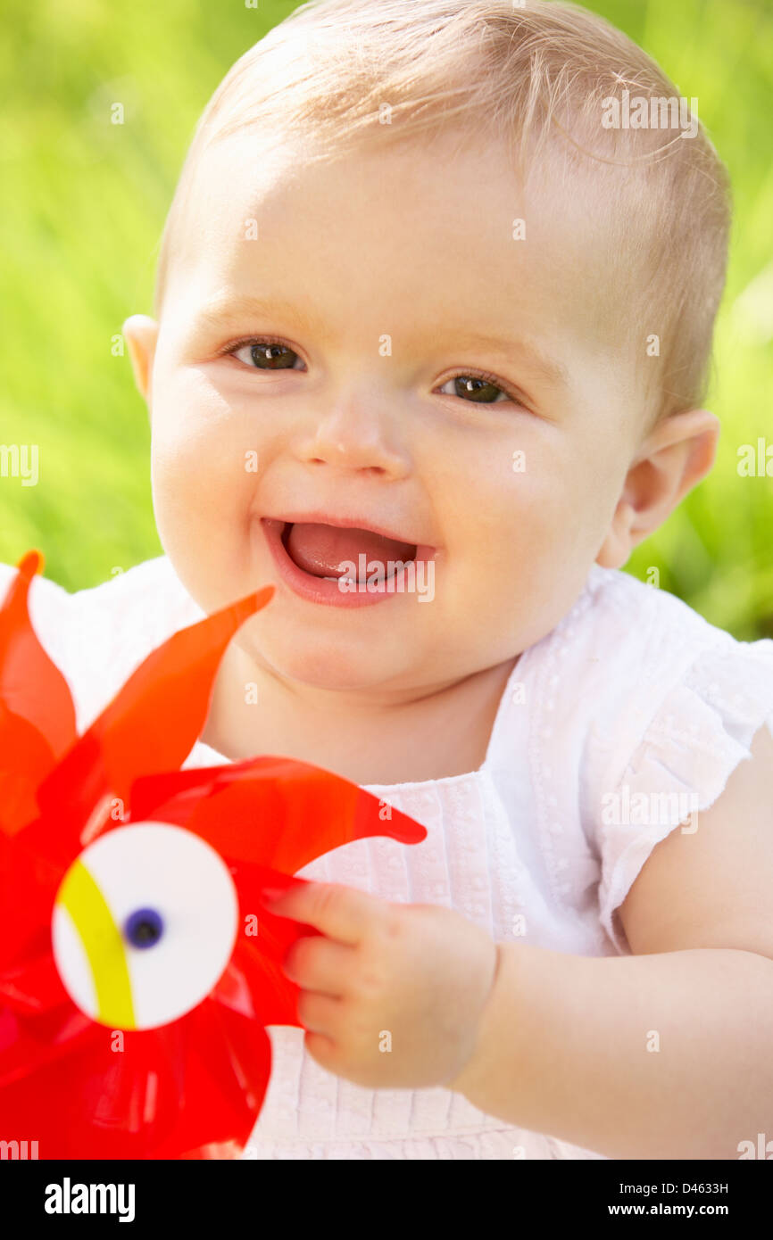Baby holding windmill hi-res stock photography and images - Alamy