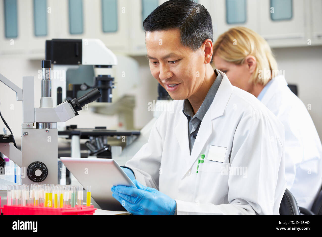Male Scientist Using Tablet Computer In Laboratory Stock Photo - Alamy