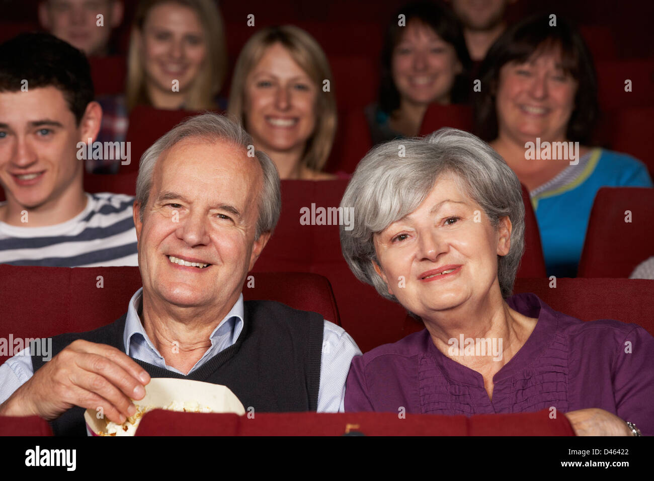 Senior Couple Watching Film In Cinema Stock Photo - Alamy