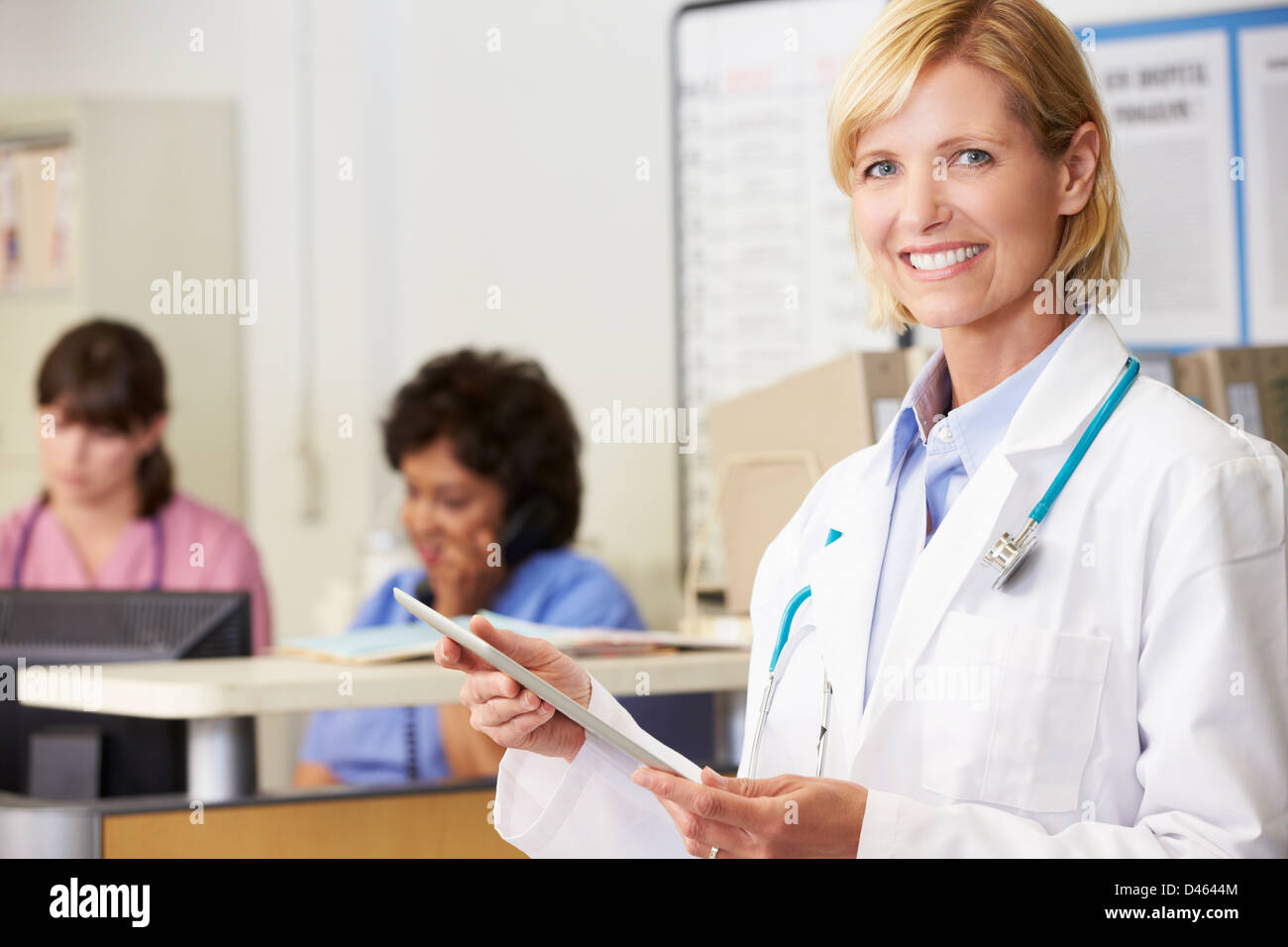 Female nurses using tablet computer hi-res stock photography and images ...