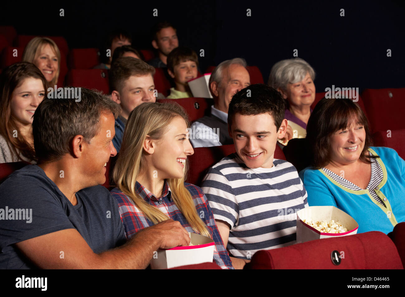 Teenage Family Watching Film In Cinema Stock Photo - Alamy