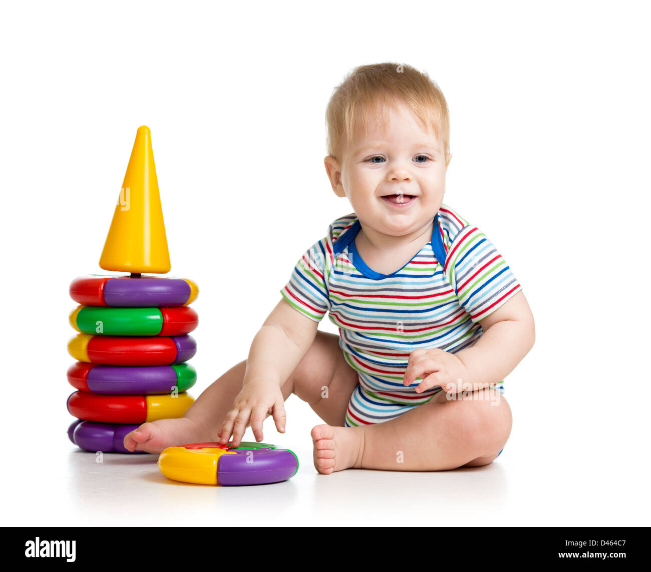 smiling child playing with color toy Stock Photo - Alamy