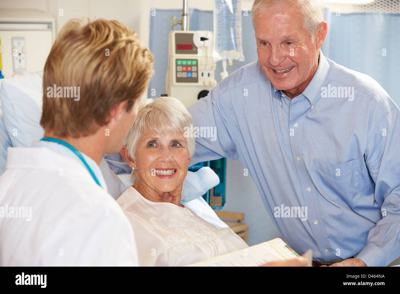 Doctor talking couple on ward hi-res stock photography and images - Alamy