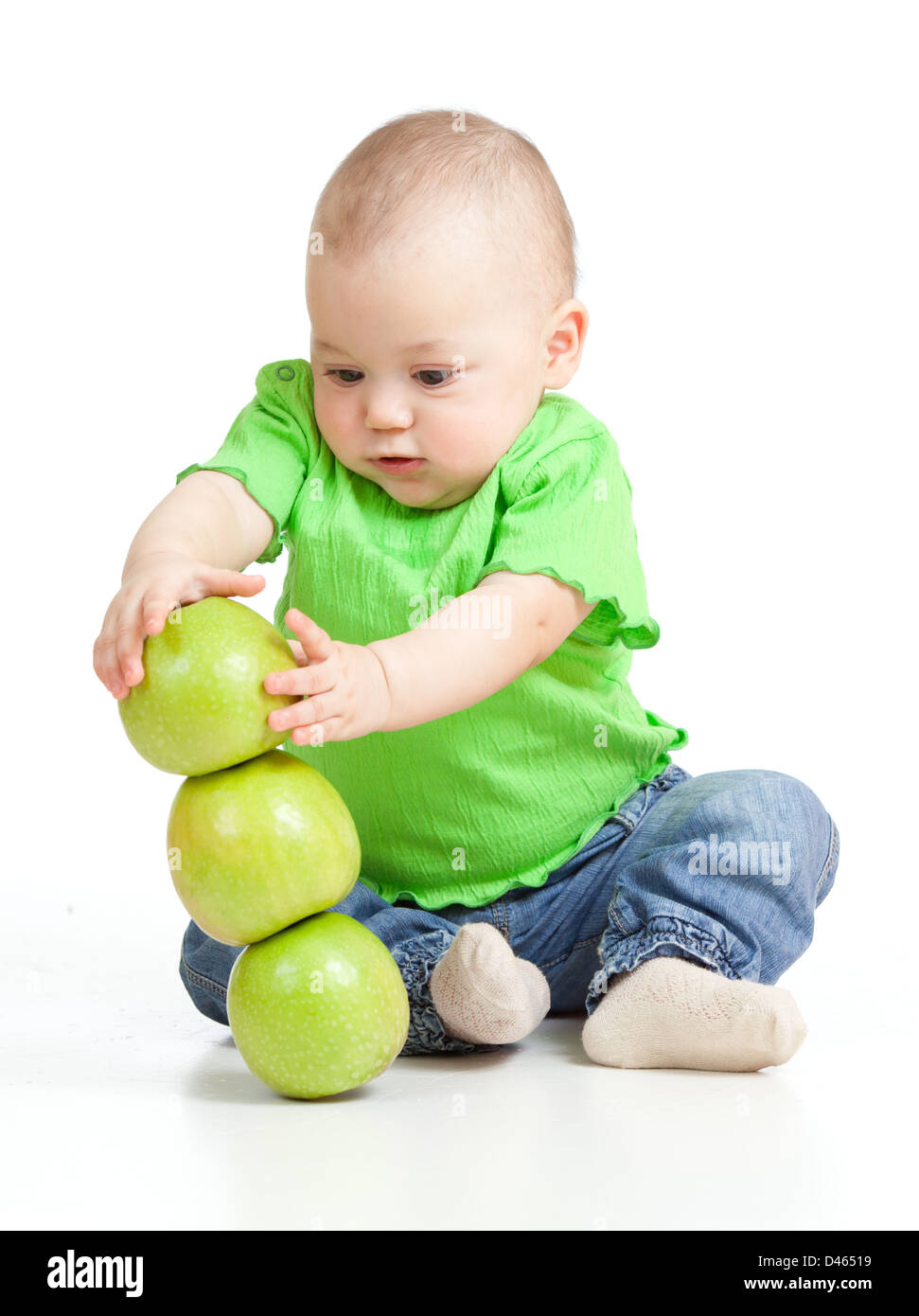 Adorable child with green apples Stock Photo - Alamy