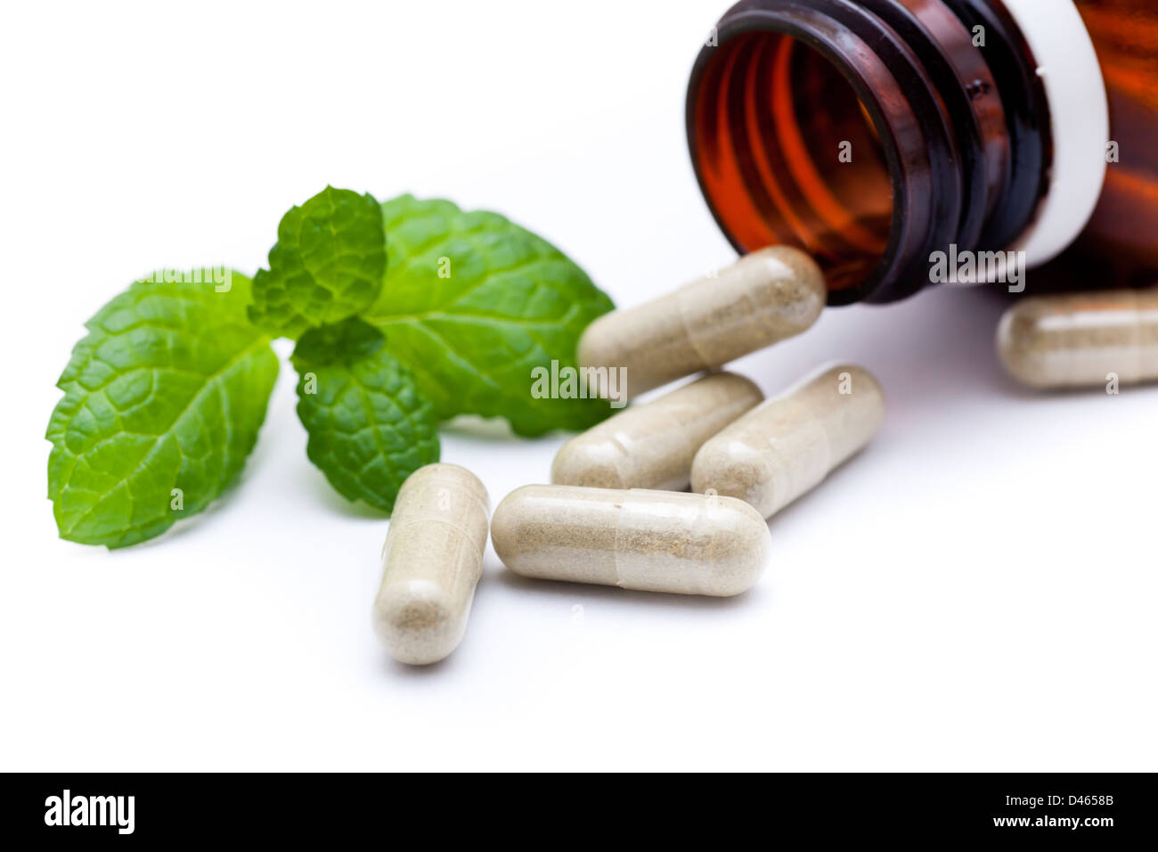 Organic capsule with mint leaves Stock Photo - Alamy