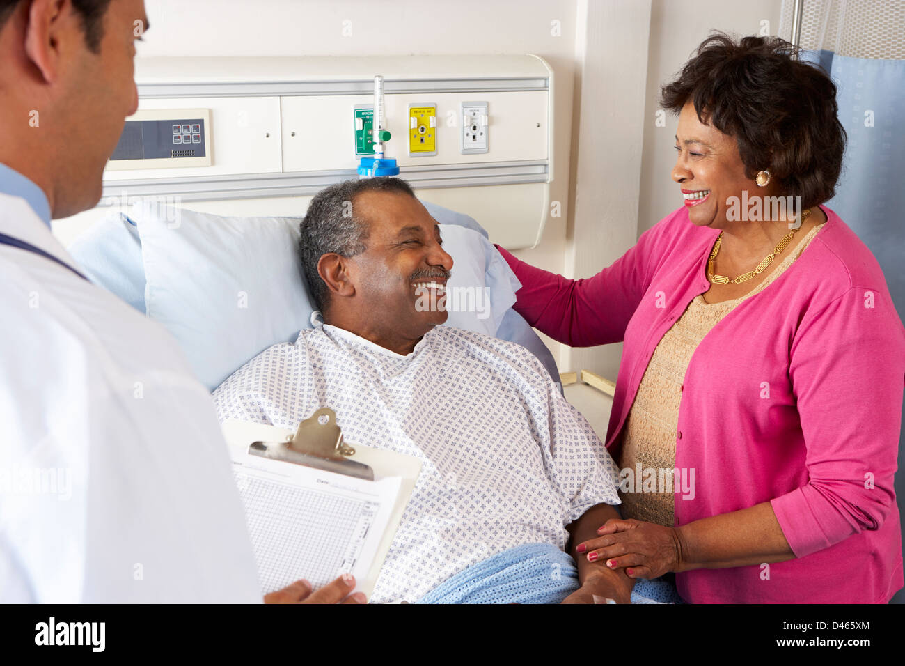 Doctor talking couple on ward hi-res stock photography and images - Alamy