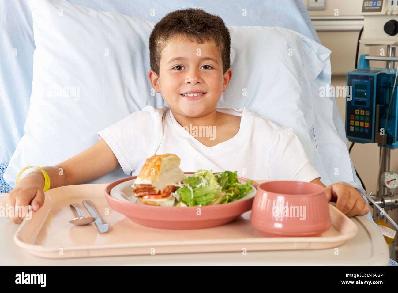 Boy Eating Meal In Hospital Bed Stock Photo - Alamy