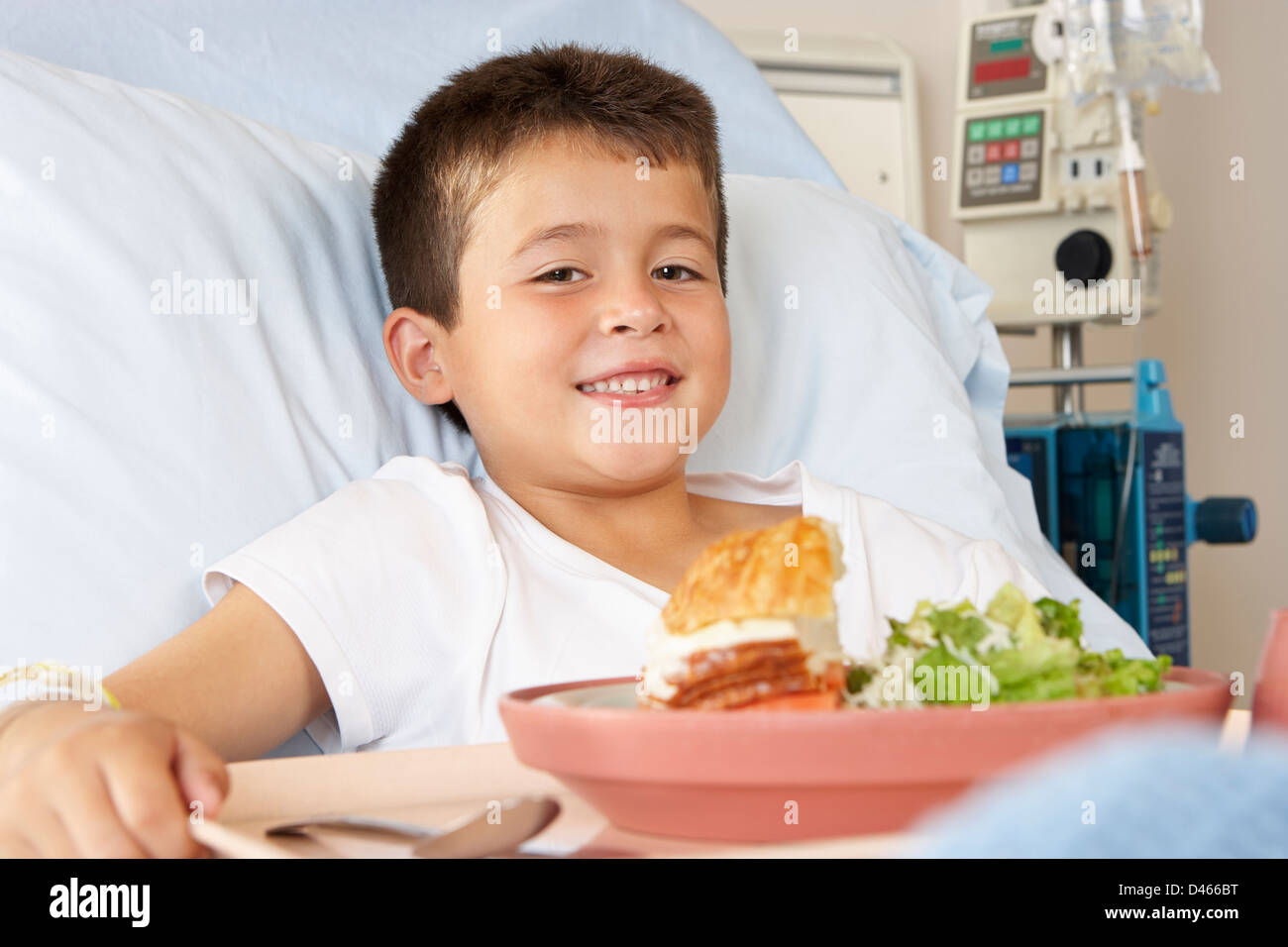 Boy Eating Meal In Hospital Bed Stock Photo - Alamy