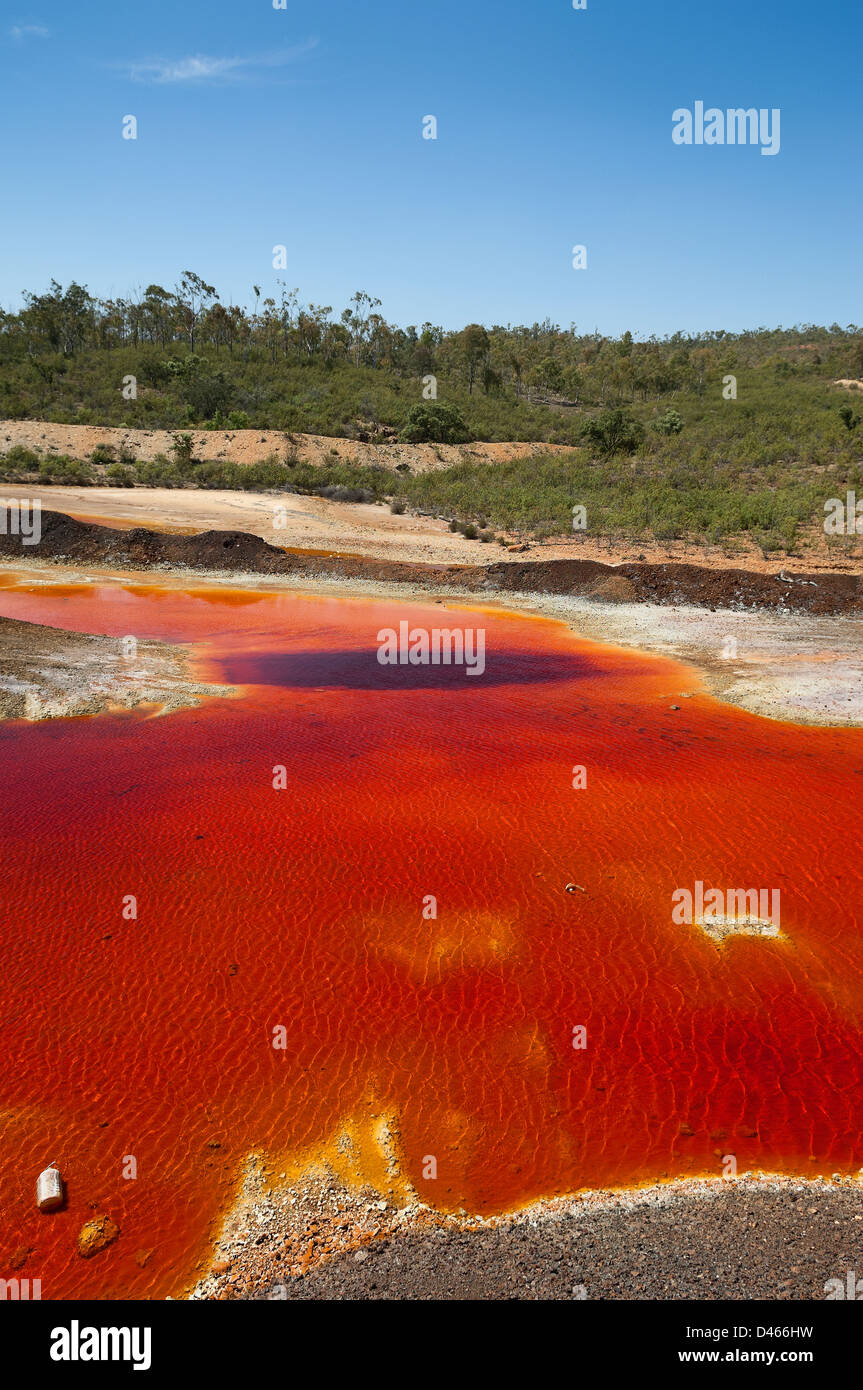 Detail of the red acid water pond in São Domingos Mine, a deserted open ...