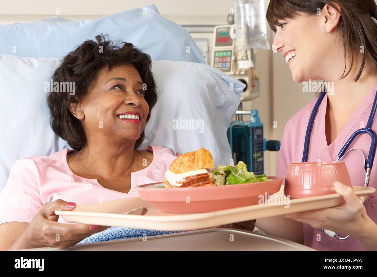 Female nurse serving food patient hi-res stock photography and images ...