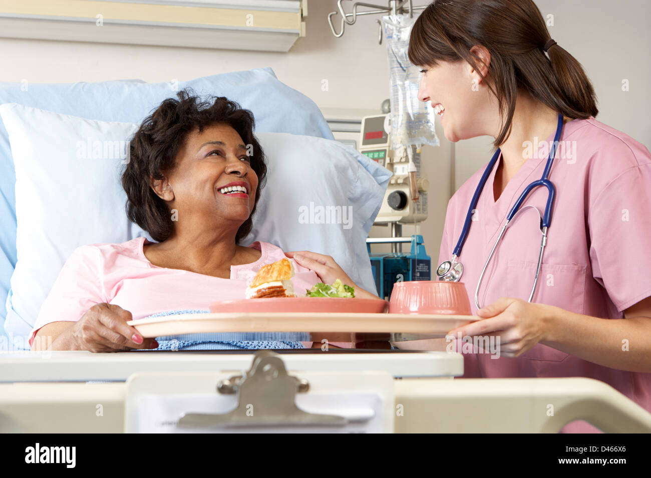 Female nurse serving food patient hi-res stock photography and images ...