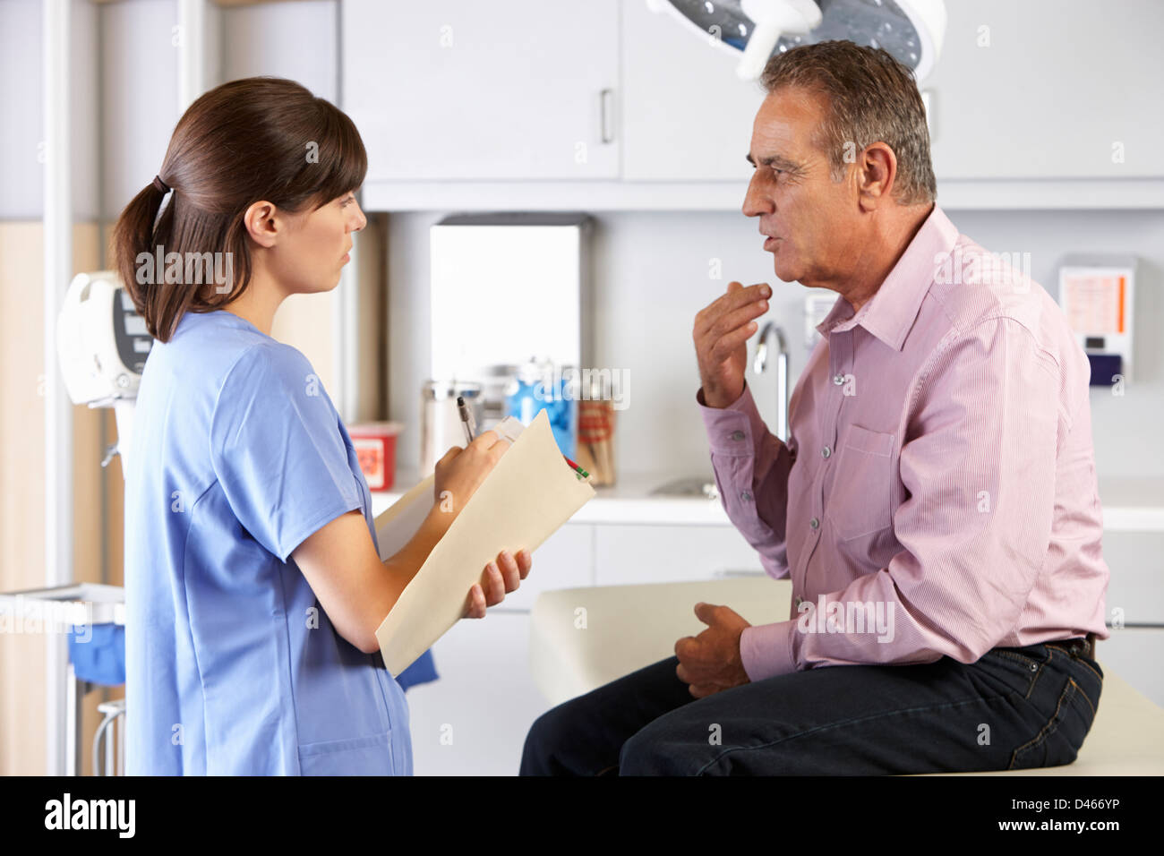 Two doctors examining medical records hi-res stock photography and ...