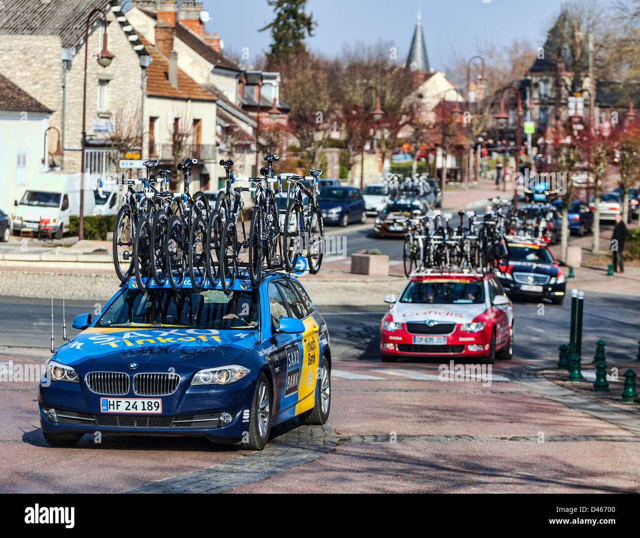 Row of technical teams cars following the cyclists during the first ...