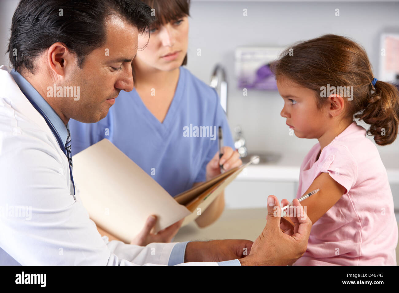 Doctor Giving Child Injection In Doctor's Office Stock Photo - Alamy