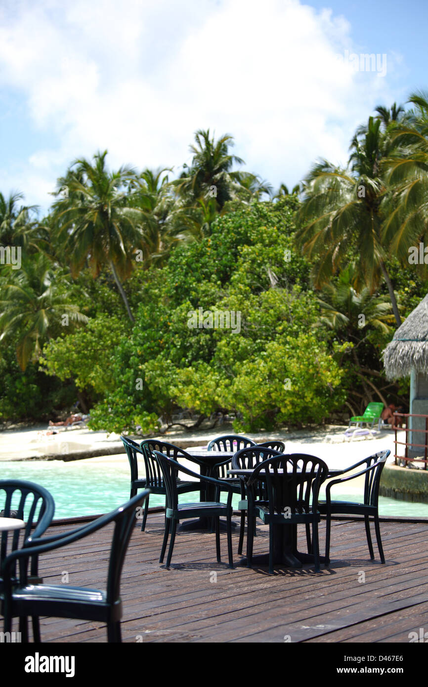 tropical cafe on the background of a palm trees and sky and sea Stock ...